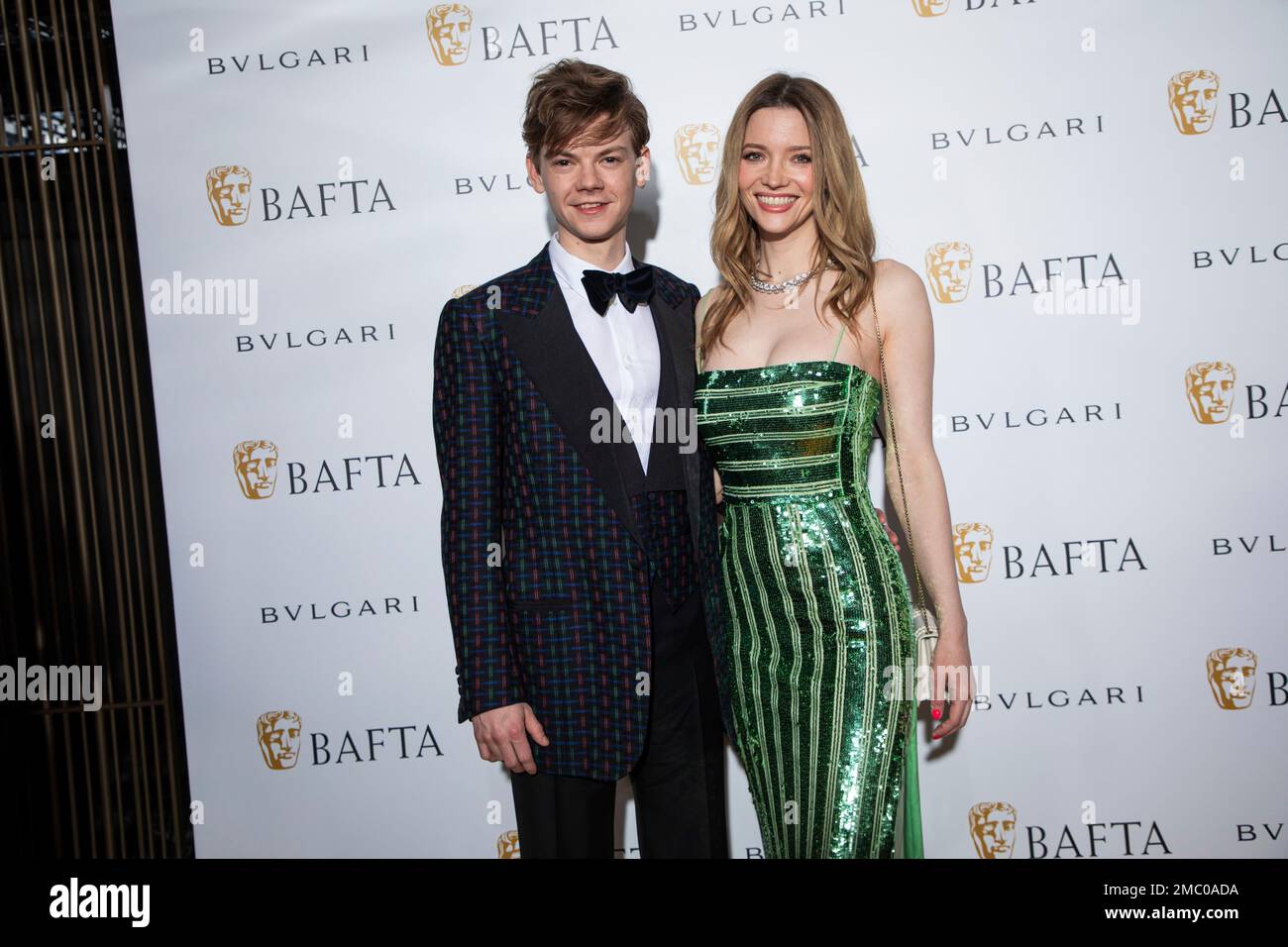 Talulah Riley, right, and Thomas Brodie-Sangster pose for photographers ...