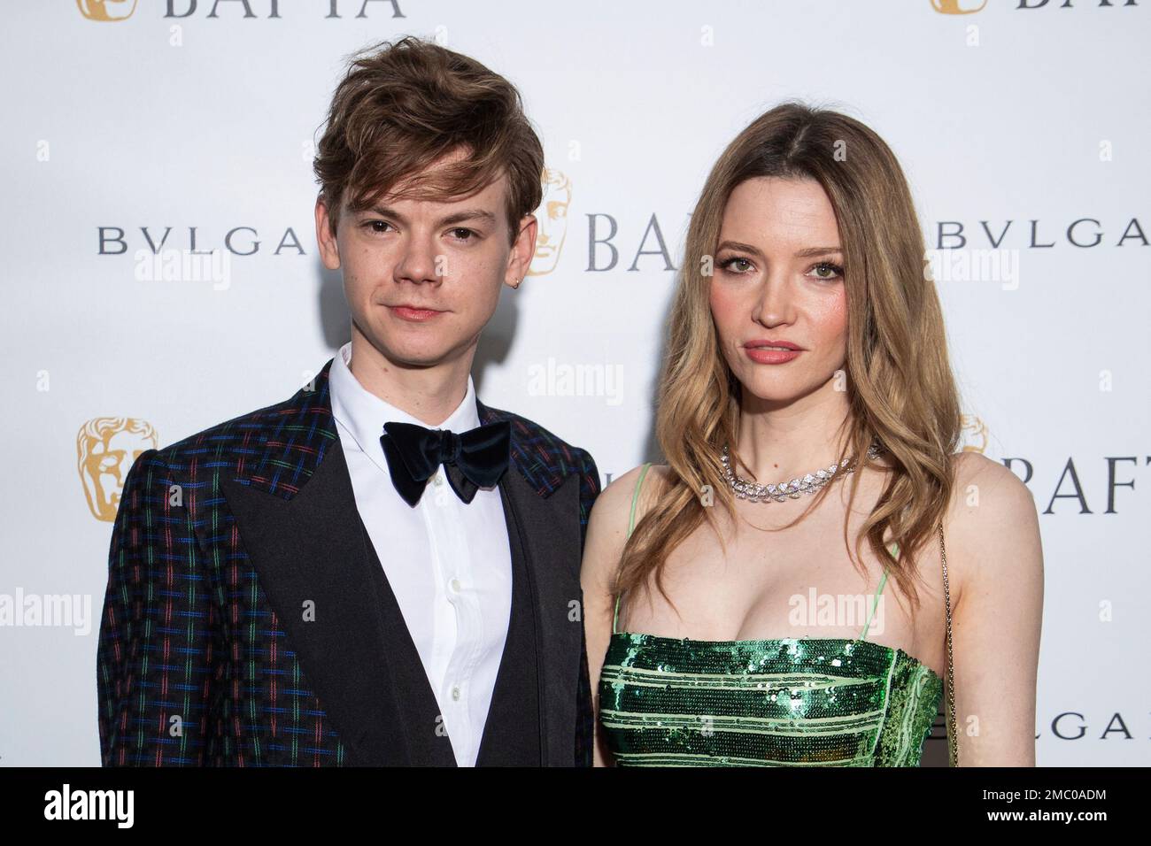 Talulah Riley, right, and Thomas Brodie-Sangster pose for photographers ...