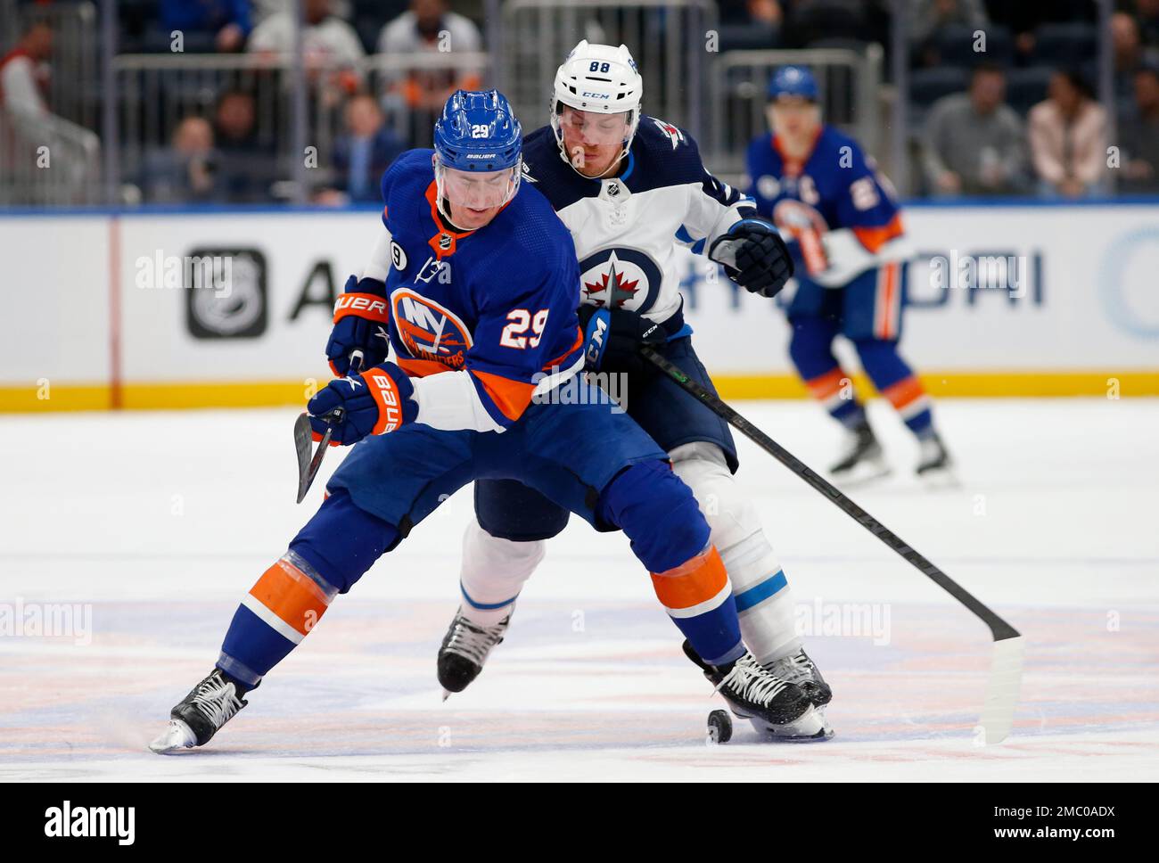 New York Islanders center Brock Nelson (29) tries to keep the puck from ...