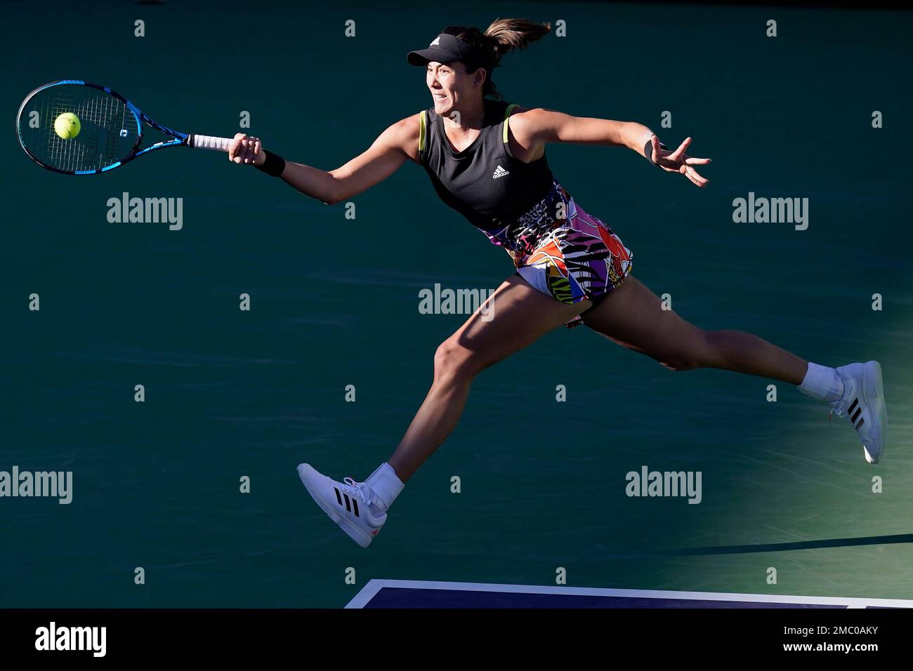 Garbine Muguruza, of Spain, returns a shot against Alison Riske at the ...