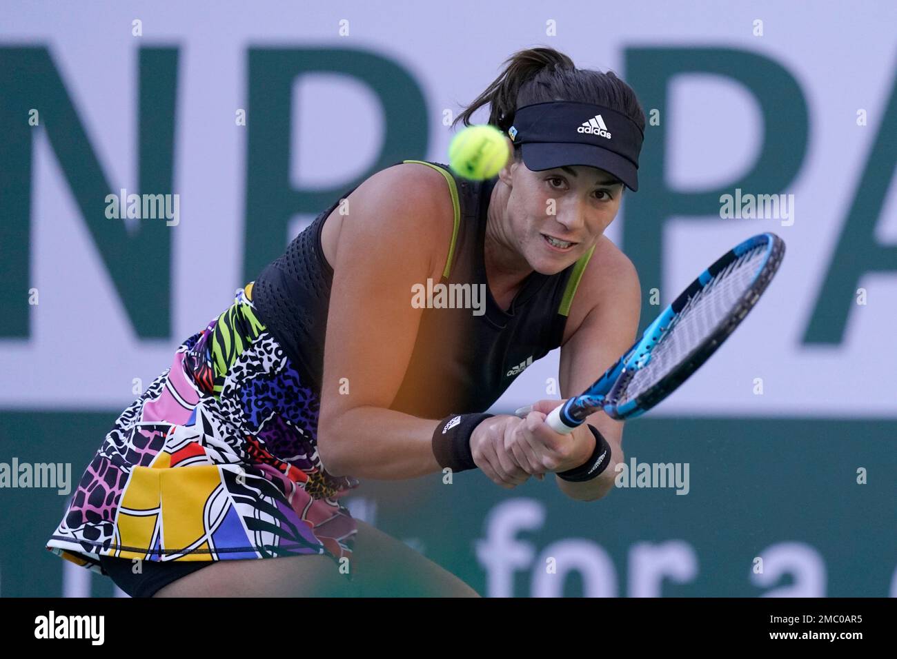 Garbine Muguruza, of Spain, returns a shot against Alison Riske at the ...