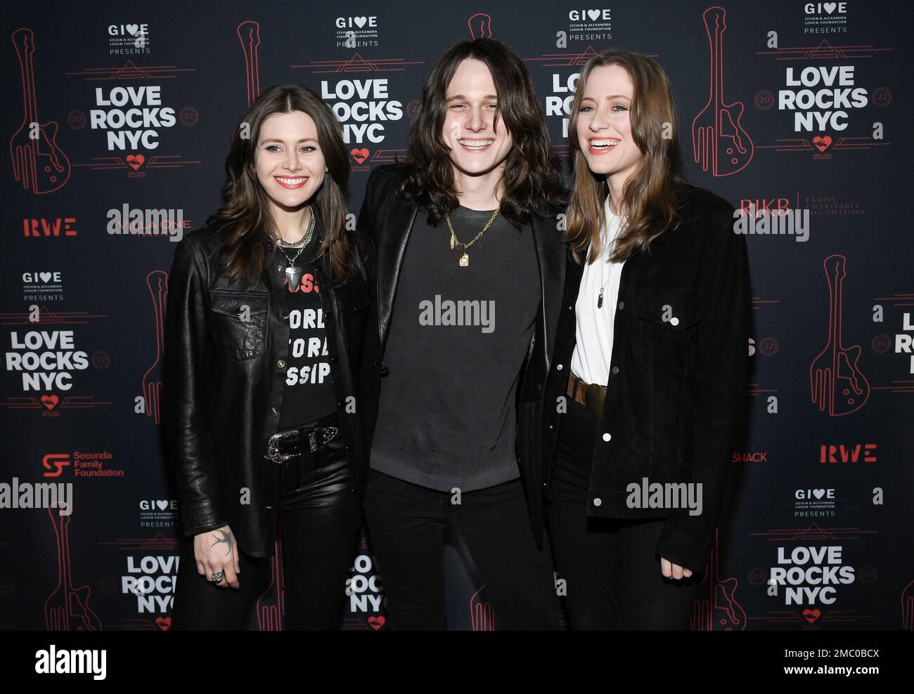 Musician Tyler Bryant, center, poses with Rebecca Lovell, left, and ...