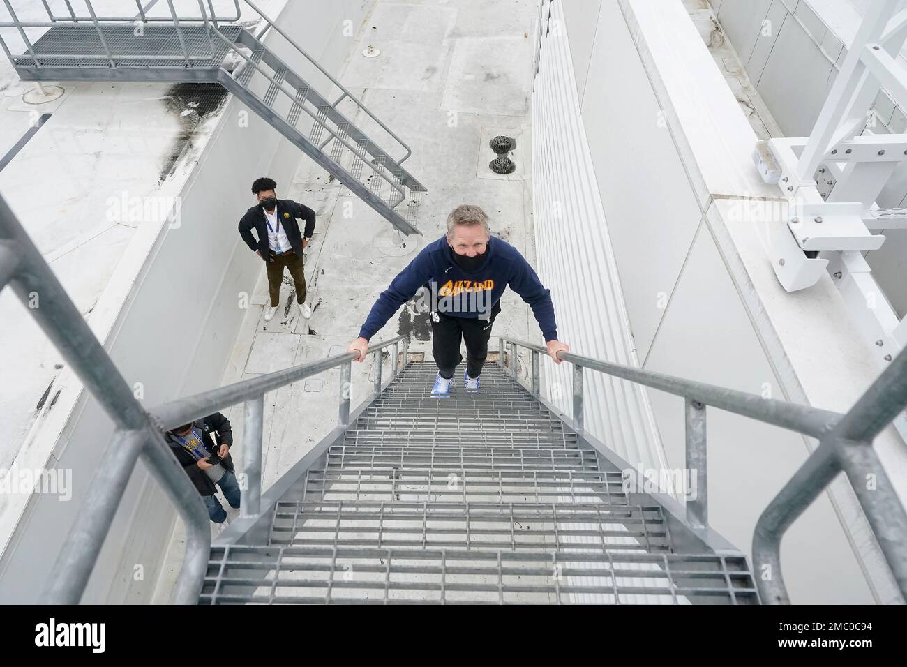 Golden State Warriors coach Steve Kerr, middle, climbs down a flight of ...
