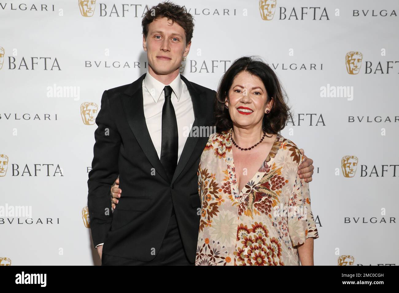 George MacKay, left, and Pippa Harris pose for photographers upon ...