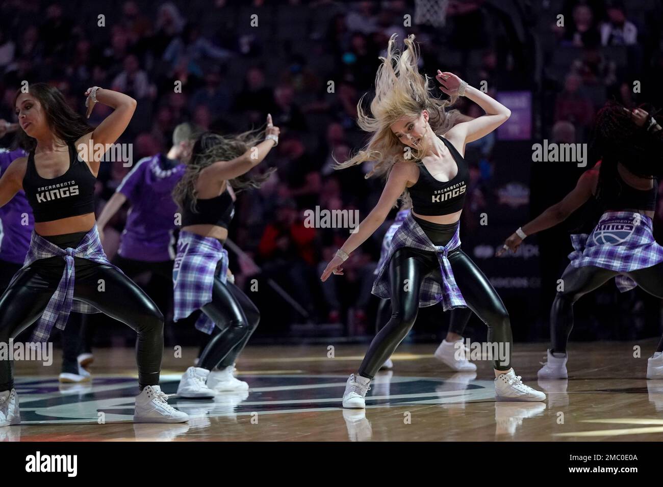 Sacramento Kings dance team members perform during an NBA basketball ...