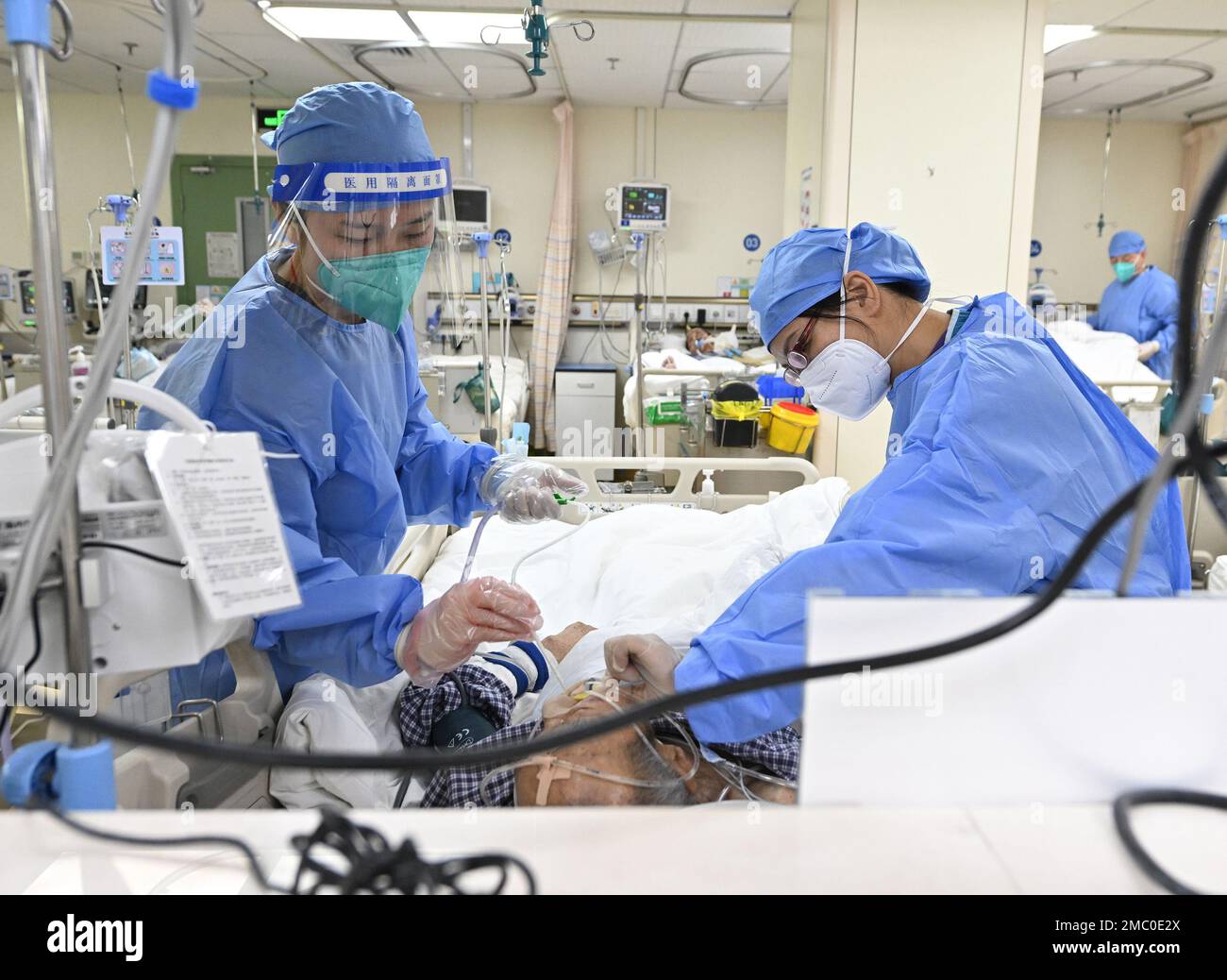 Beijing, China. 21st Jan, 2023. Nurses conduct sputum suction for an ...
