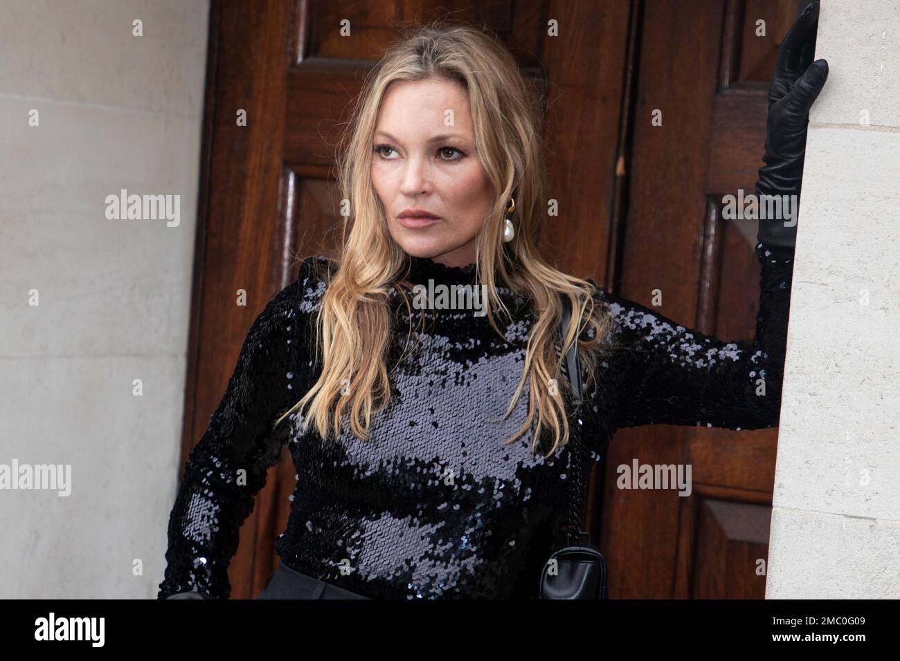 Kate Moss poses for photographers upon arrival at the Burberry fashion ...