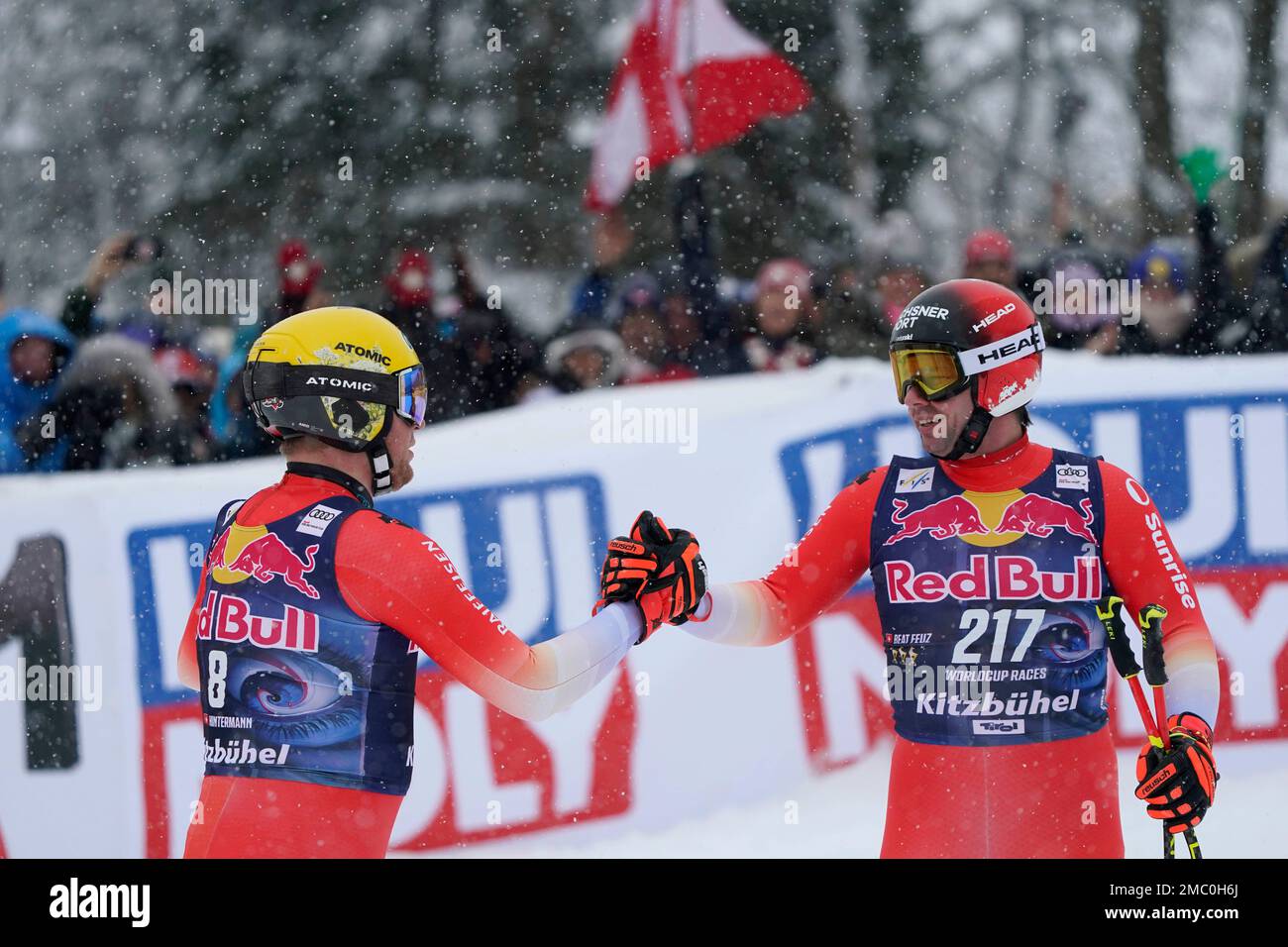 Switzerland's Beat Feuz , right, cheers with his teammate Niels ...