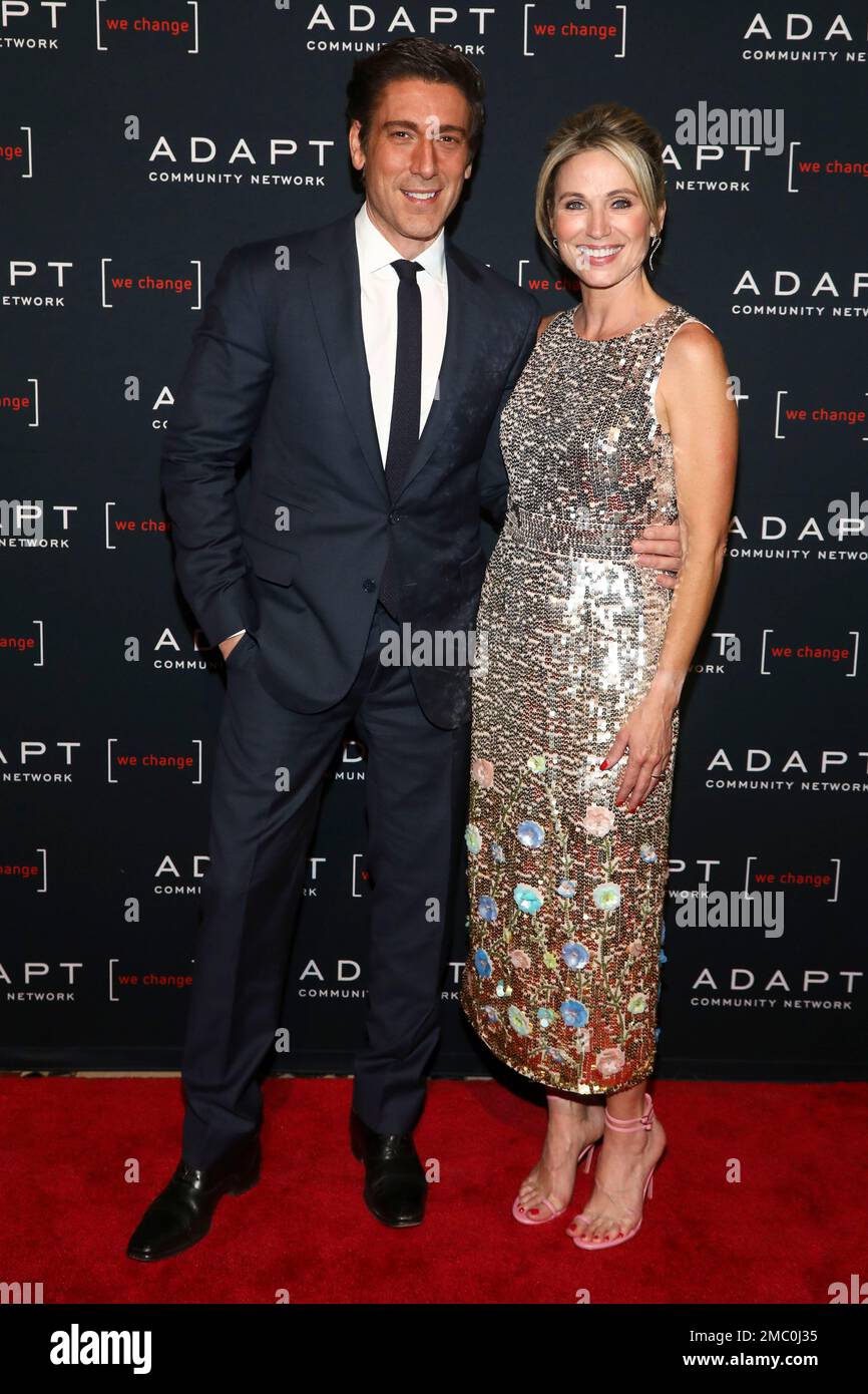 Television journalists David Muir, left, and Amy Robach, right, attend ...