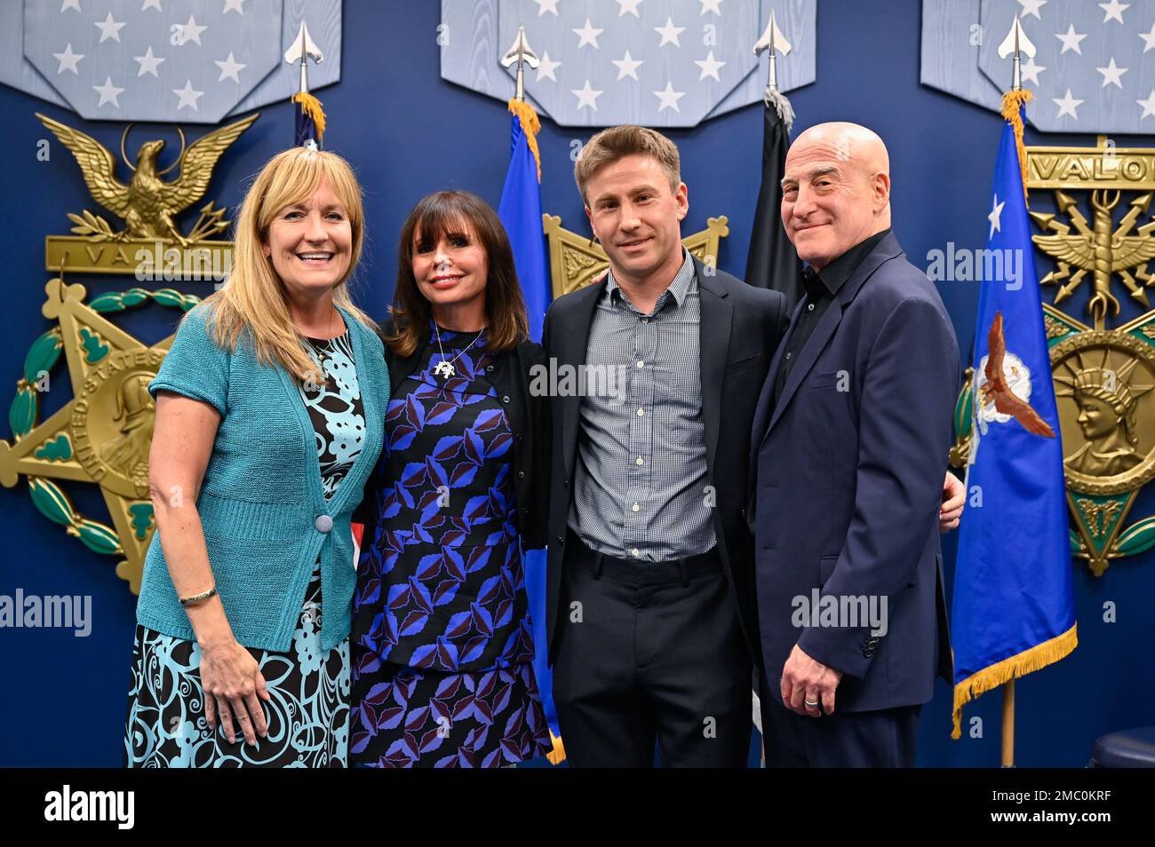 A guest, left, poses with Heidi and Erik Murkoff and their son, Wyatt ...