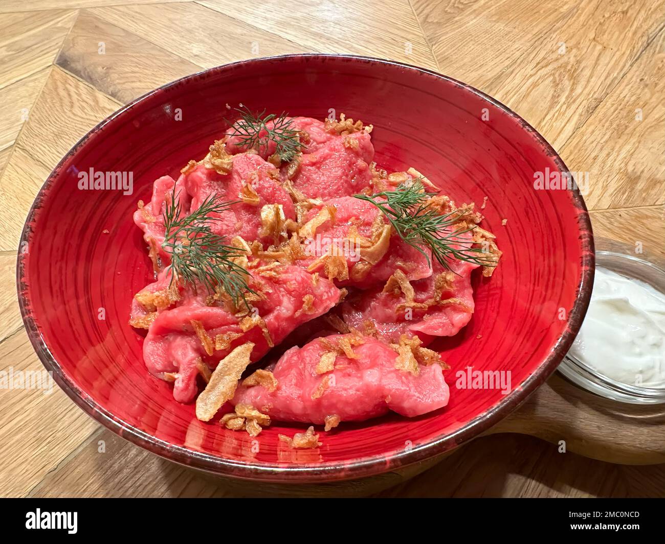 Exclusive red beetroot dumplings in a beautiful clay plate Stock Photo ...