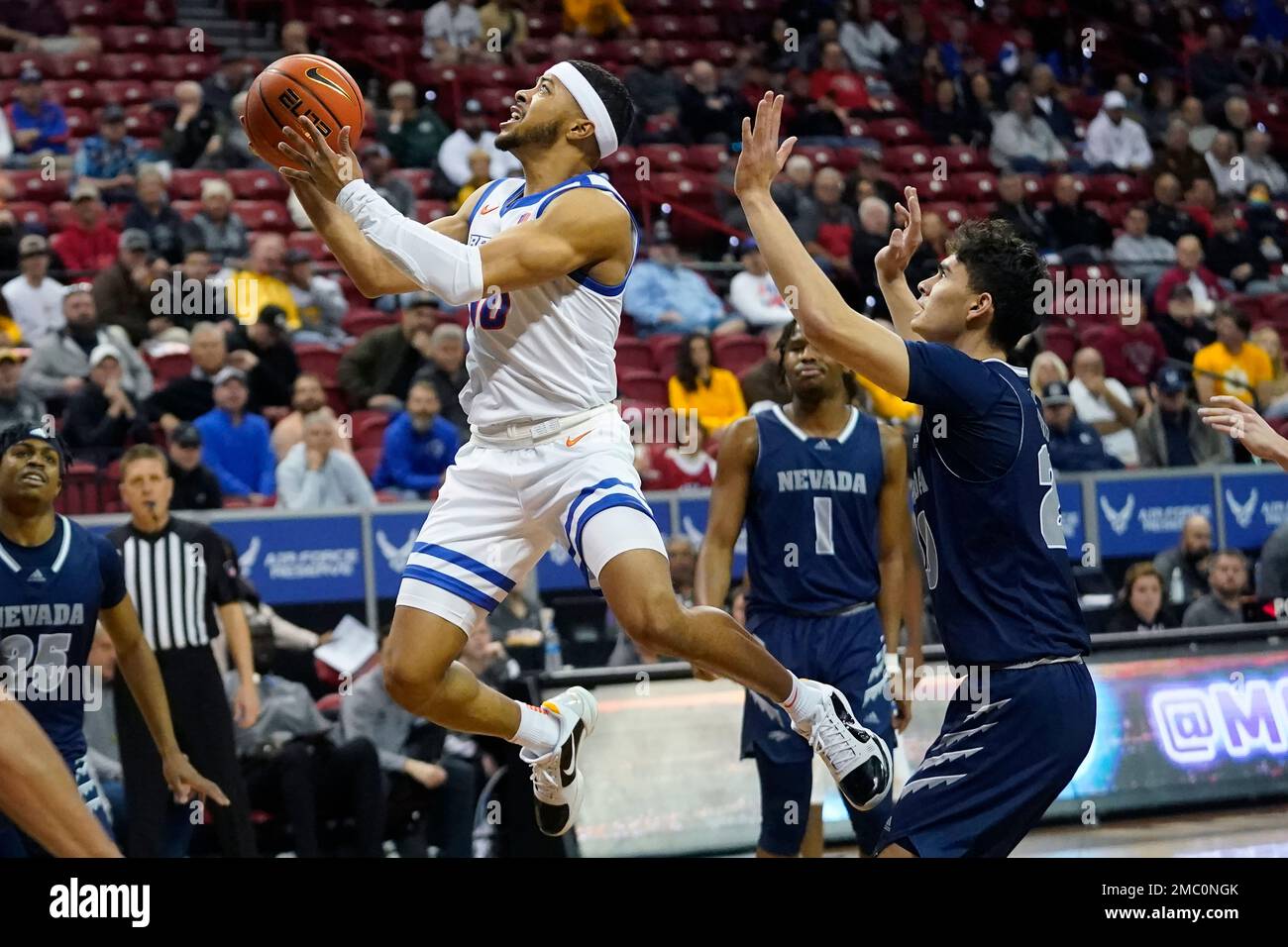 Boise State guard Marcus Shaver Jr., left, goes to the basket as Nevada ...