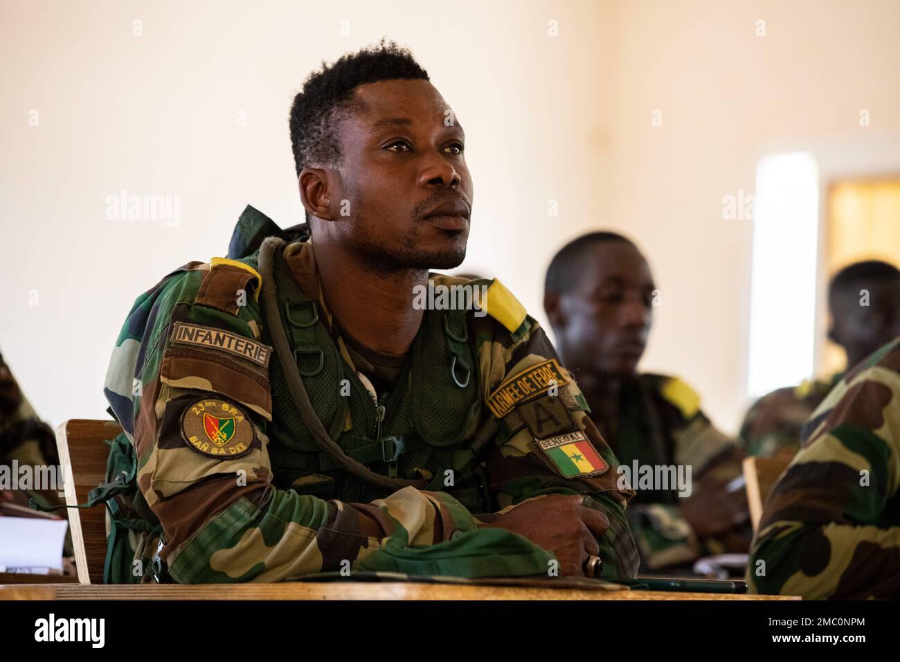 A Senegalese Armed Forces (SAF) soldier takes notes at a nighttime ...