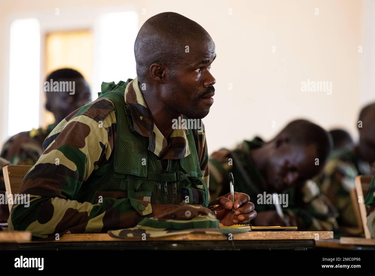 A Senegalese Armed Forces (SAF) soldier takes notes at a nighttime ...