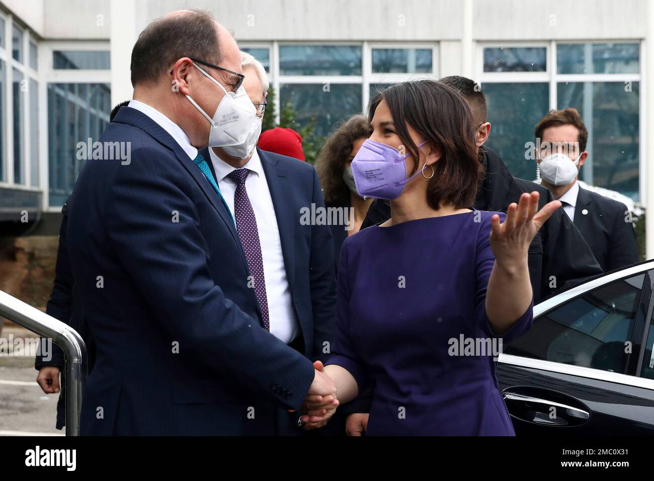 German Foreign Minister Annalena Baerbock, right, shakes hands with ...