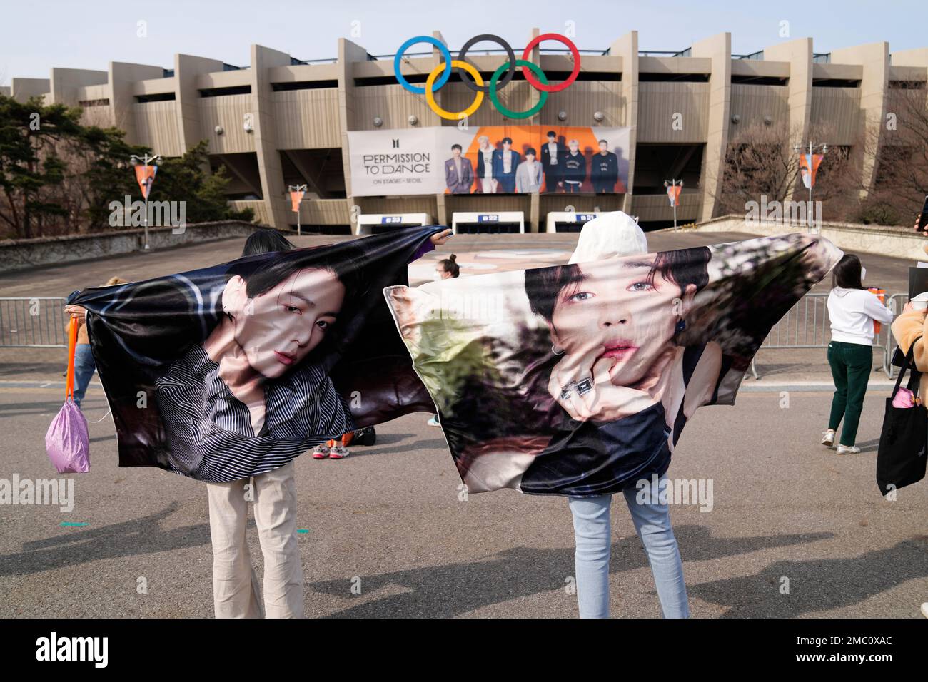 Fans of South Korean K-pop band BTS pose for a photo upon they arrived ...