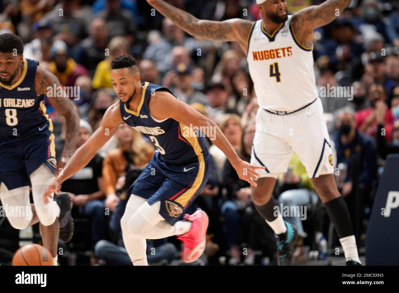 New Orleans Pelicans guard CJ McCollum (3) and Denver Nuggets center ...