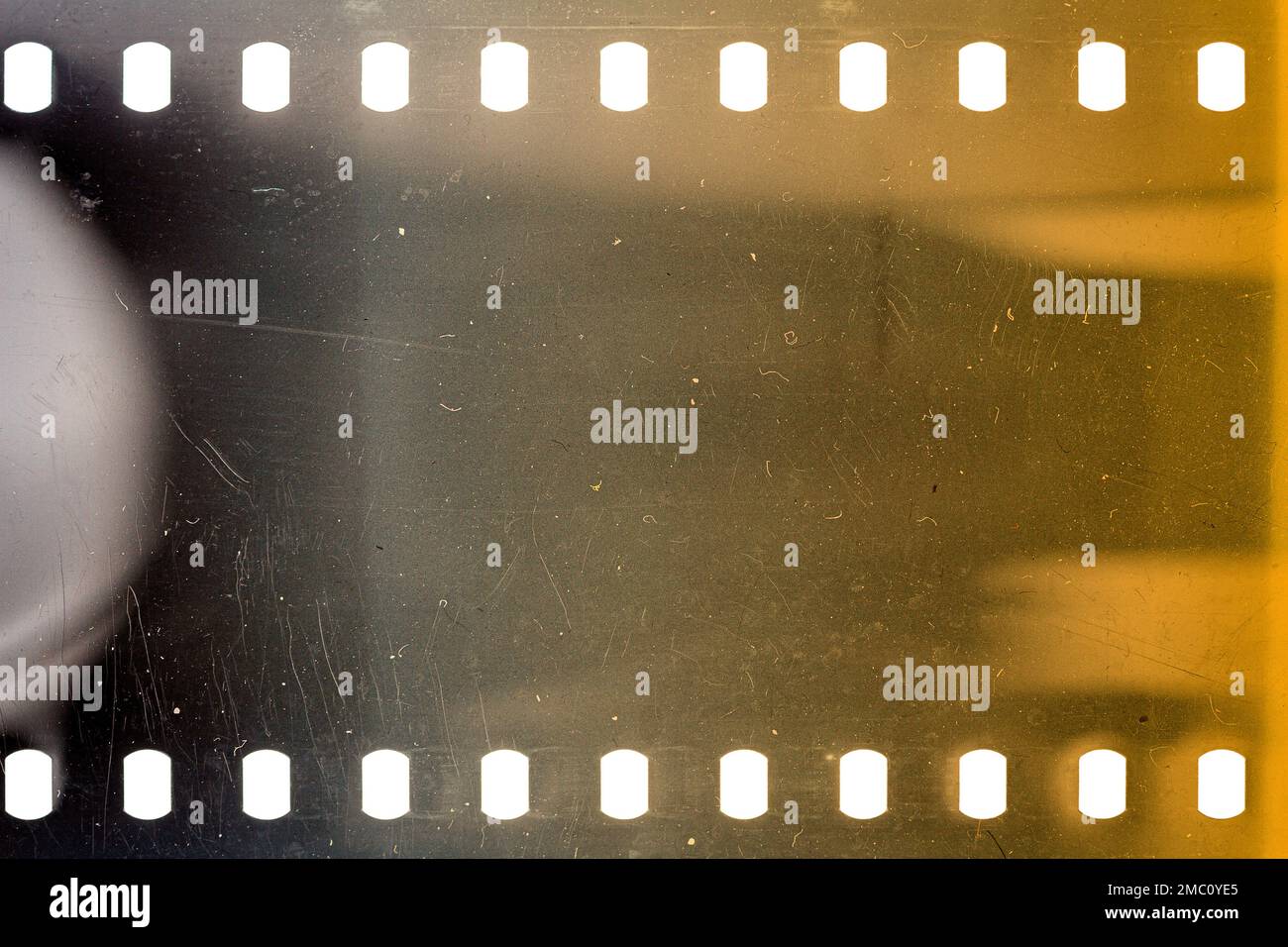 Dusty and grungy 35mm film texture or surface. Perforated scratched ...