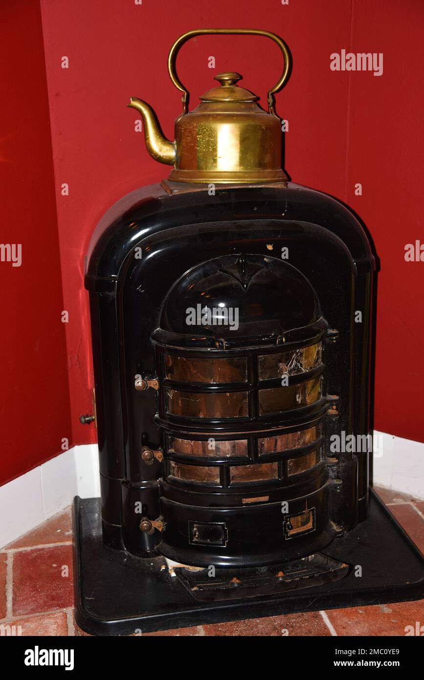 Alkmaar, Netherlands. January 2023. An old coal stove with a kettle ...