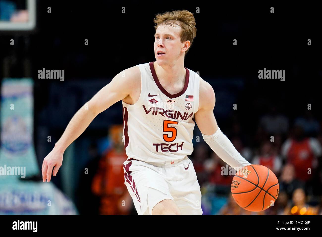 Virginia Tech's Storm Murphy (5) looks to pass in overtime of an NCAA ...