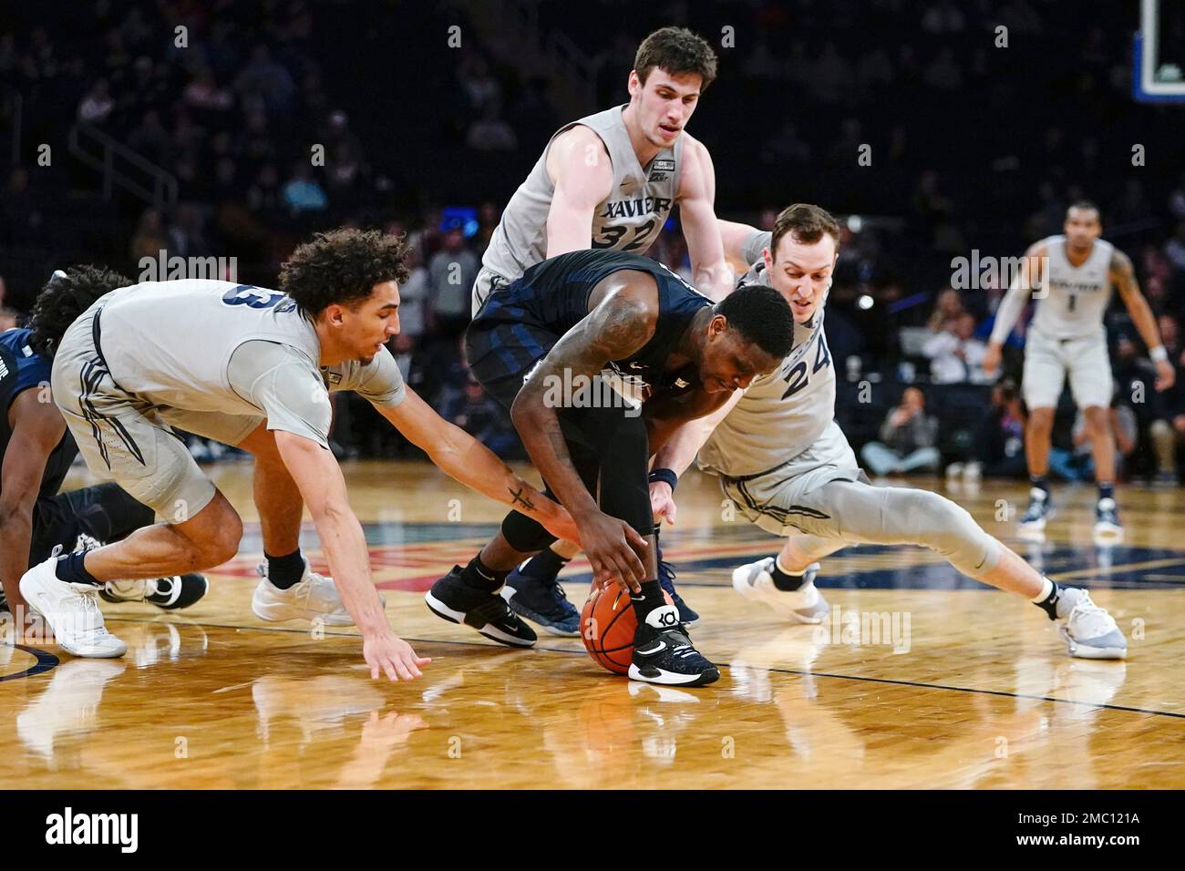 Butler's Bo Hodges (1) fights for control of the ball with Xavier's ...