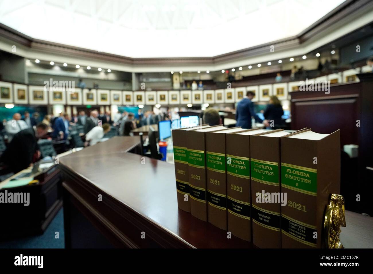 Books of Florida Statues sit on a desk as Representatives work in the ...