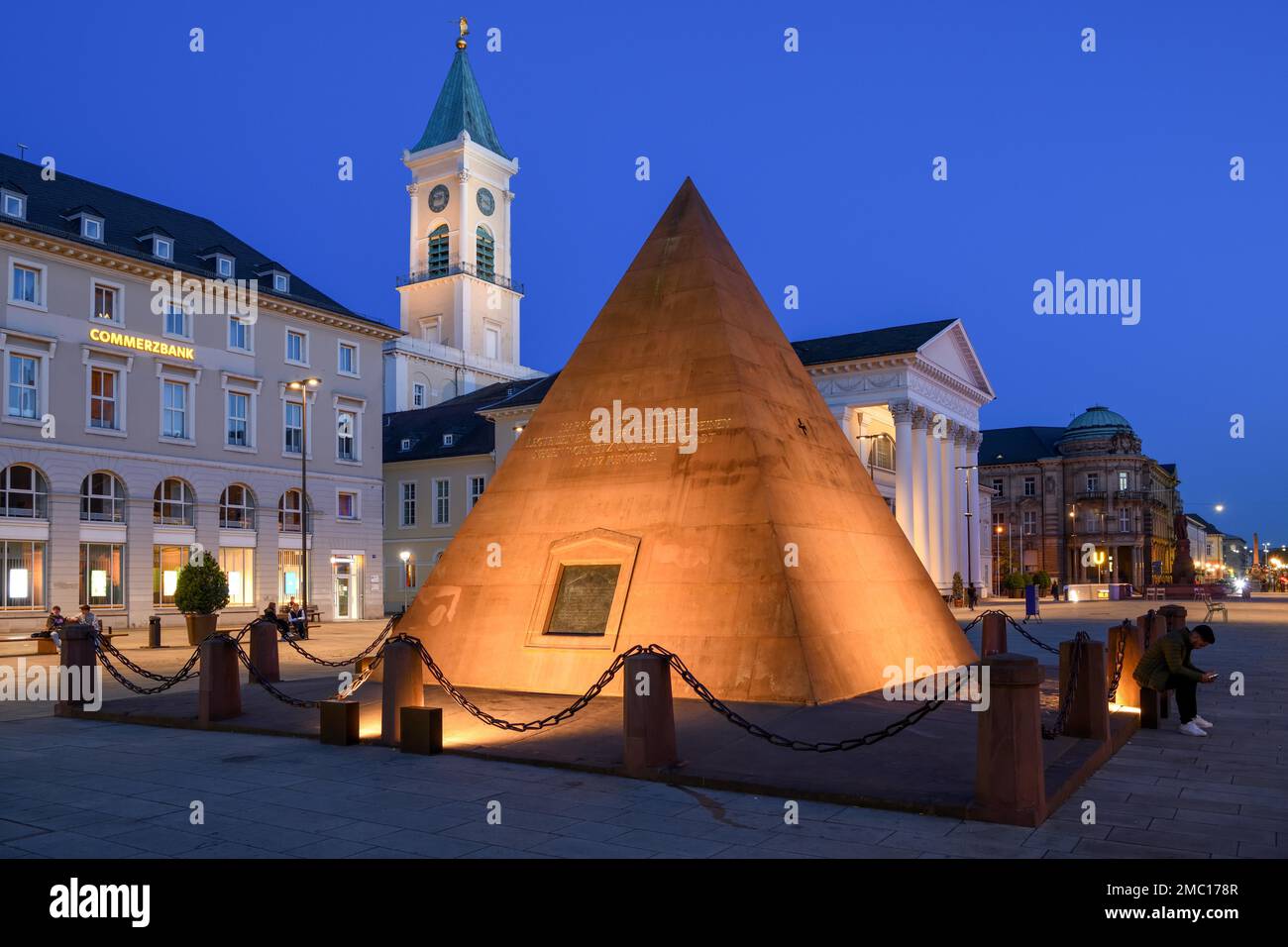 Illuminated pyramid on the market square, in the background the ...
