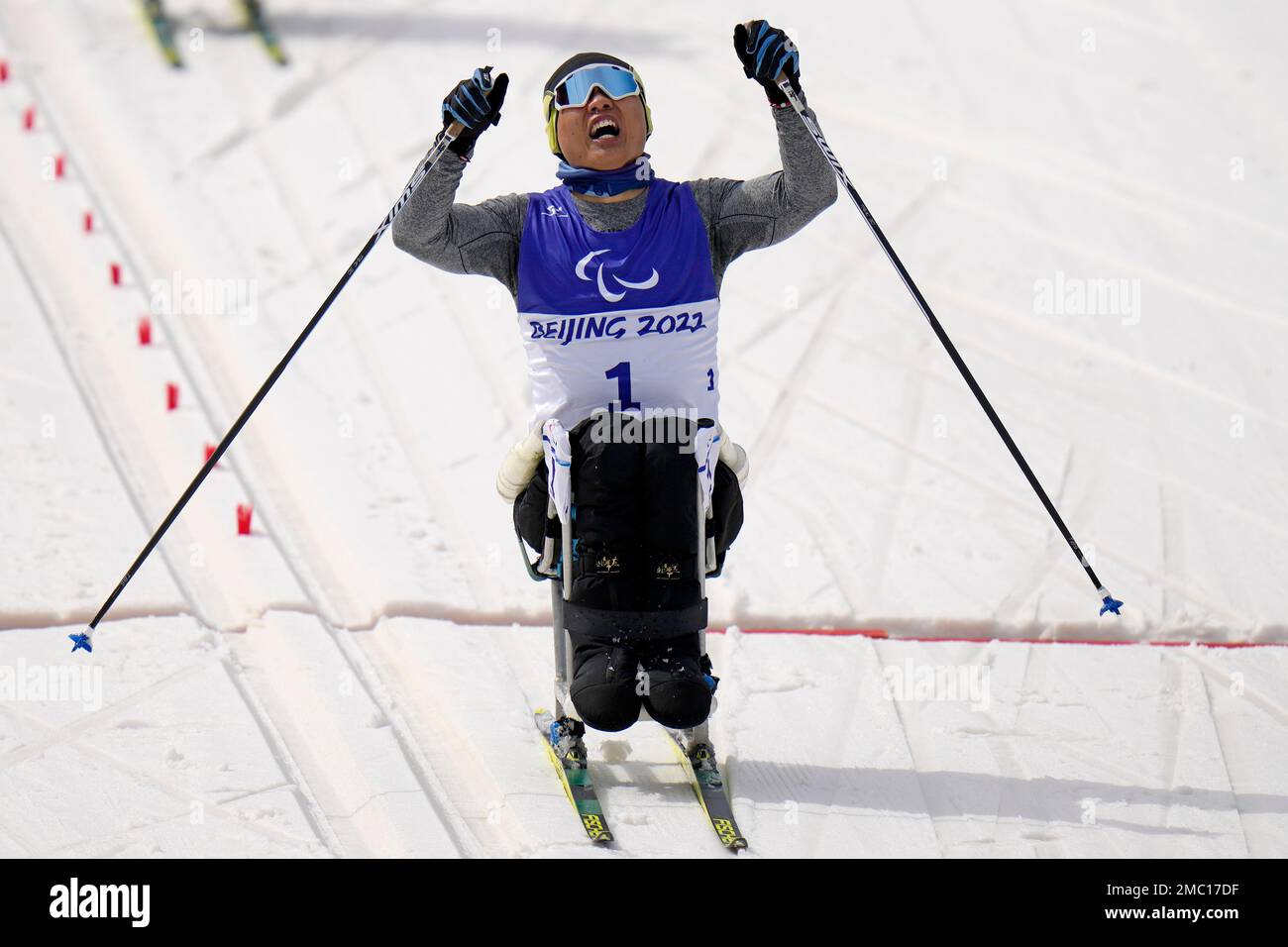 Zheng Peng of China crosses the finish line to win the men's sprint ...