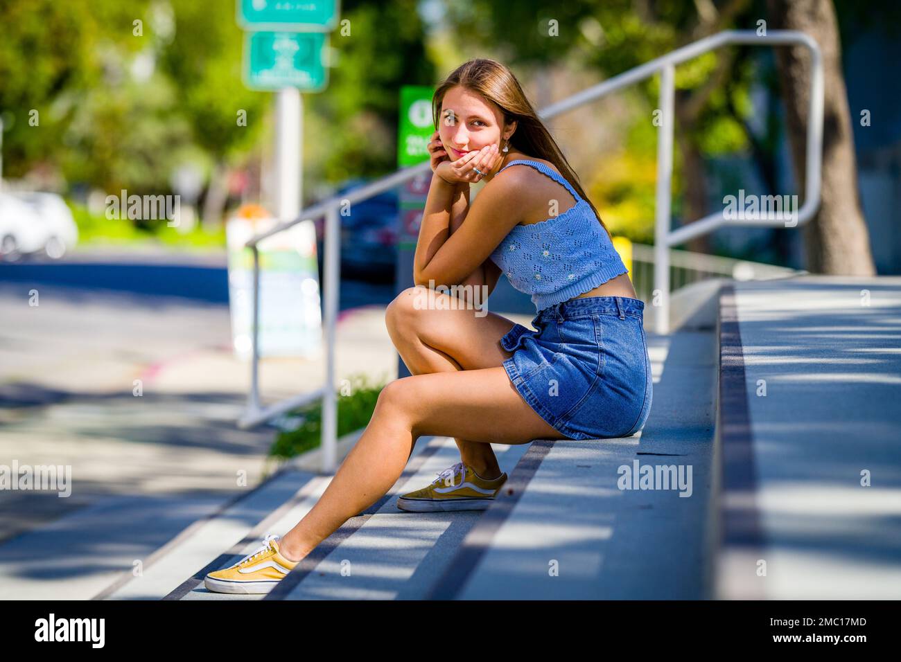 Teenage Girl Sitting on Steps in Front of City Hall Plaza in Downtown ...