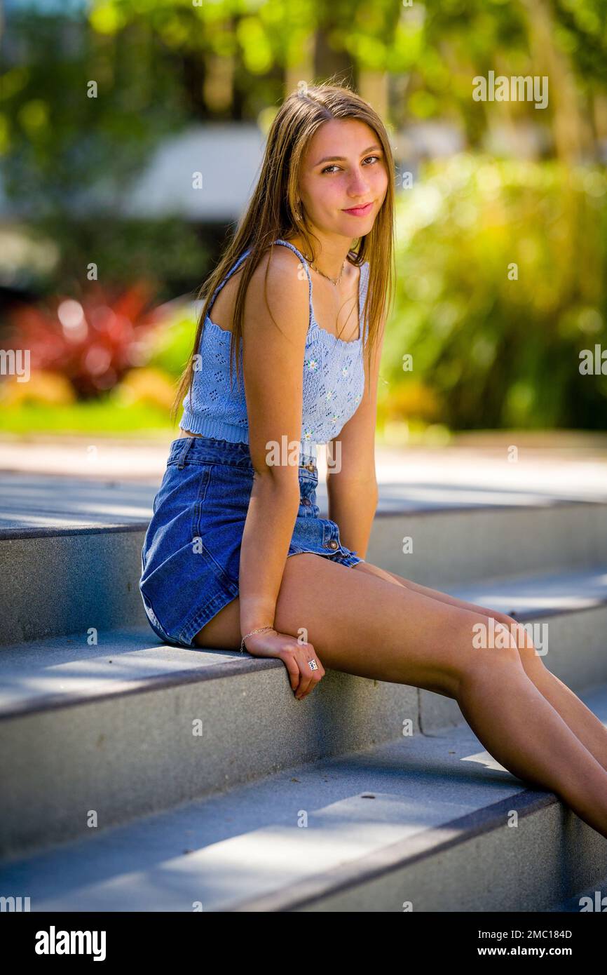 Teenage Girl Sitting on Steps in Front of City Hall Plaza in Downtown ...