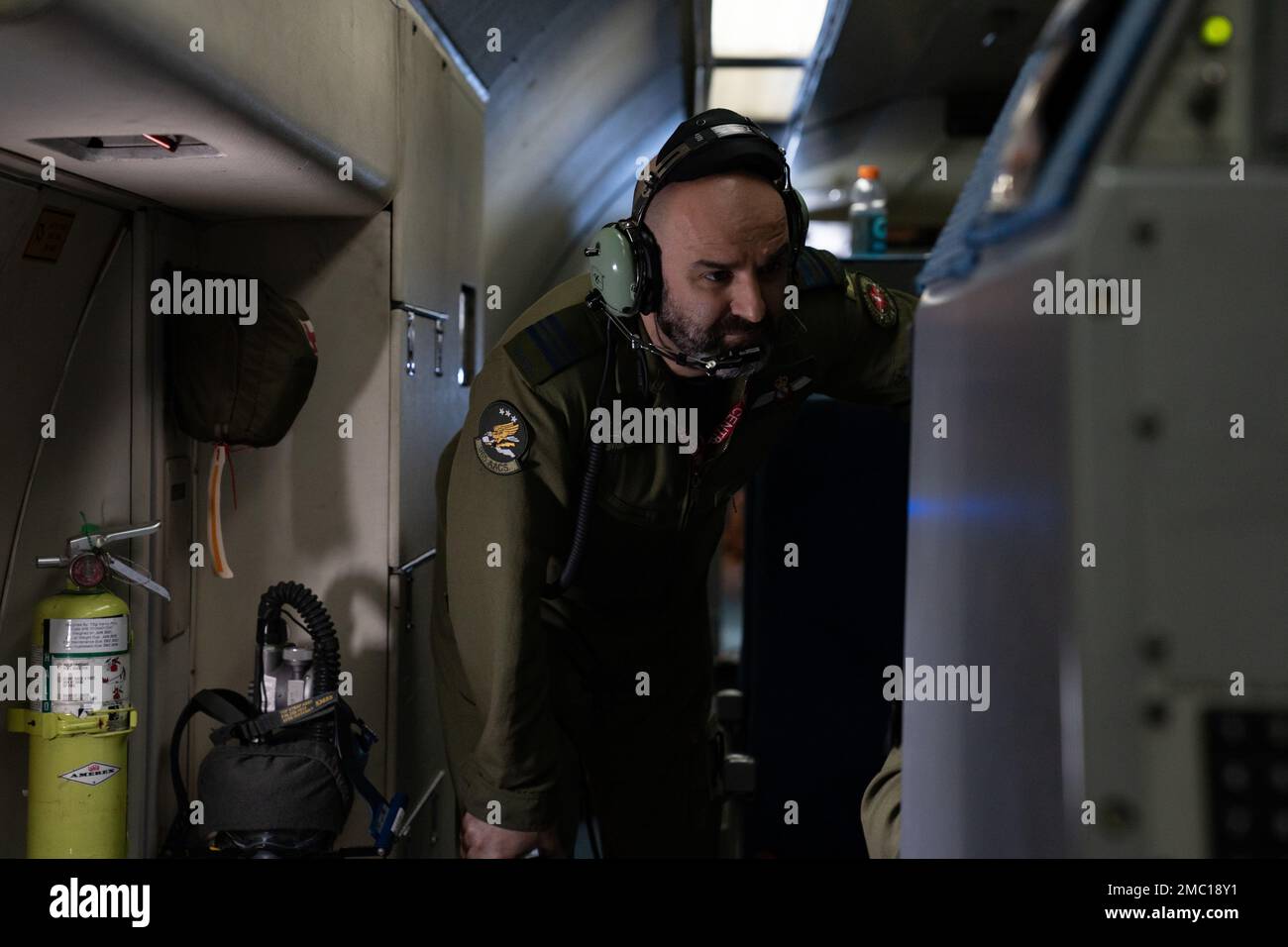 A Canadian Royal Air Force member aboard an E-3 Sentry Airborne Warning ...