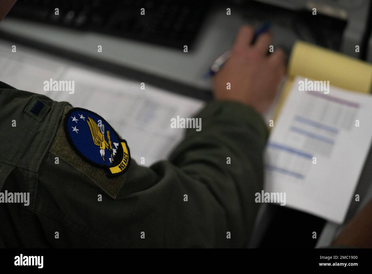 A U.S Air Force crew member aboard a E-3 Sentry Airborne Warning and ...