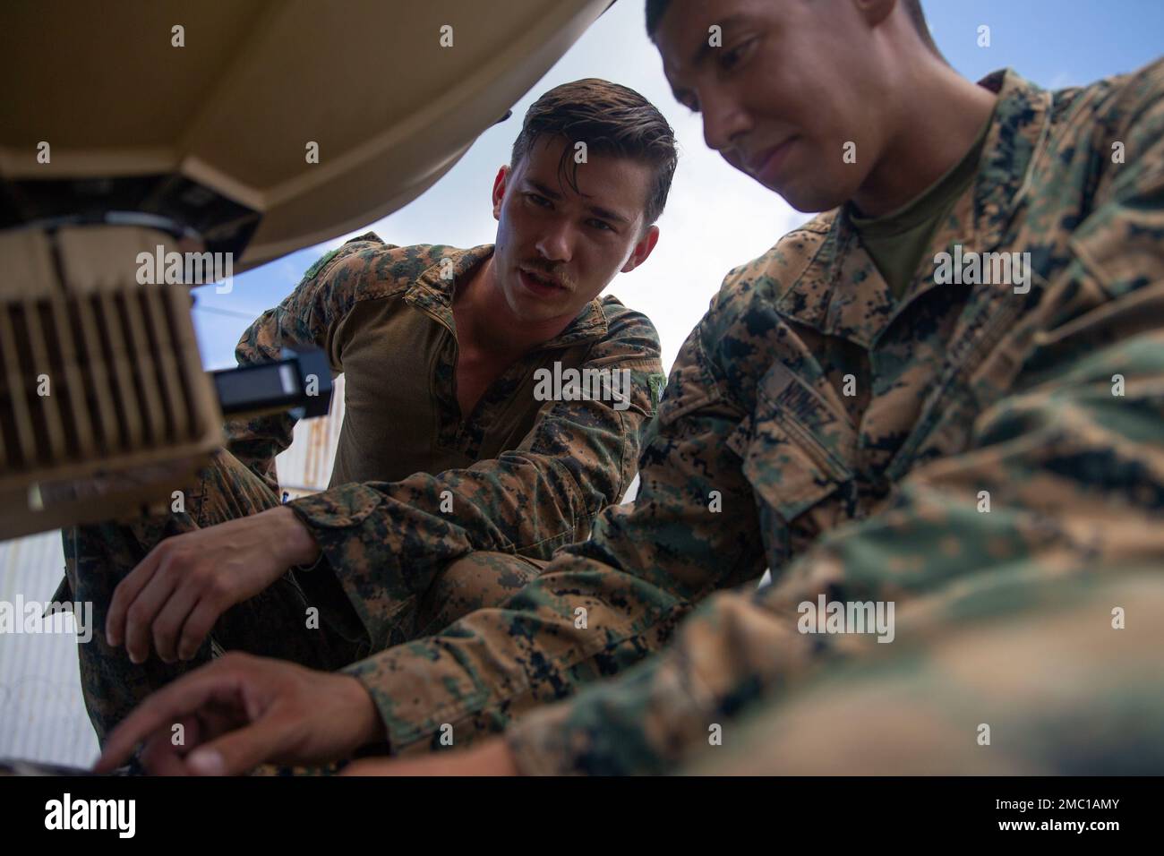 U.S. Marine Corps Sgt. Mateo Lopez, a satellite transmissions system ...
