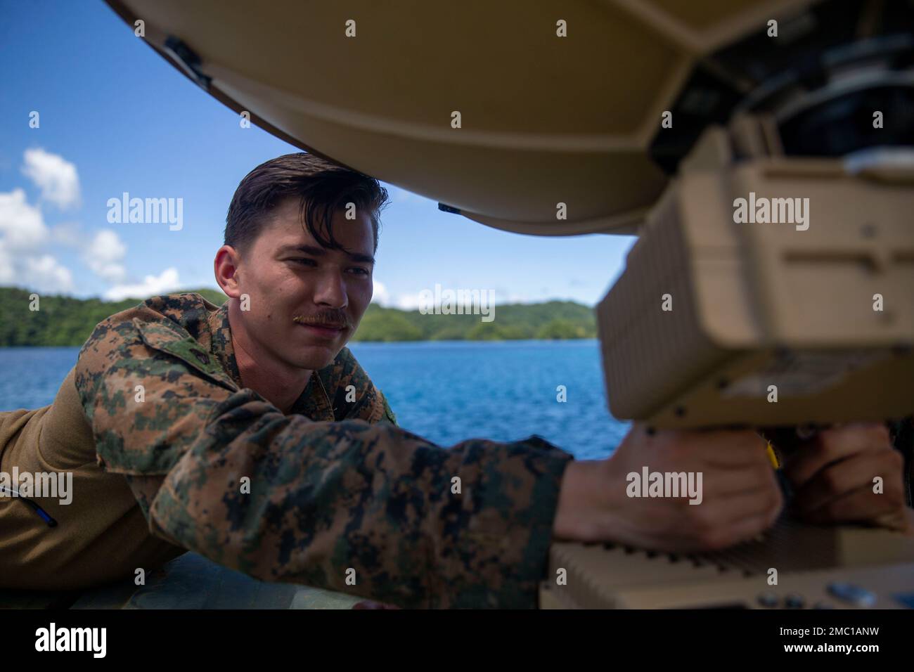U.S. Marine Corps Sgt. Mateo Lopez, a satellite transmissions system ...