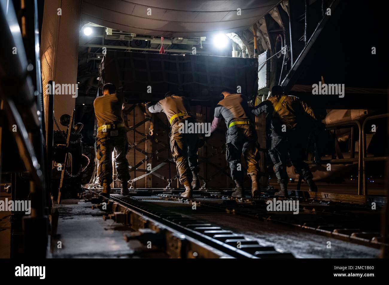 Ramp services personnel from the 436th Aerial Port Squadron, load a ...