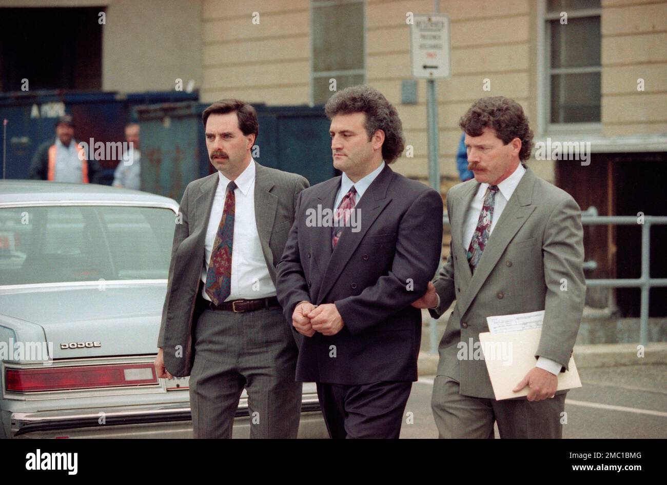 Joey Buttafuoco walks handcuffed between two Nassau County detectives ...