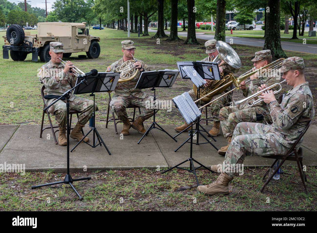 U.S. Army Training and Doctrine Command Band plays brass instruments ...
