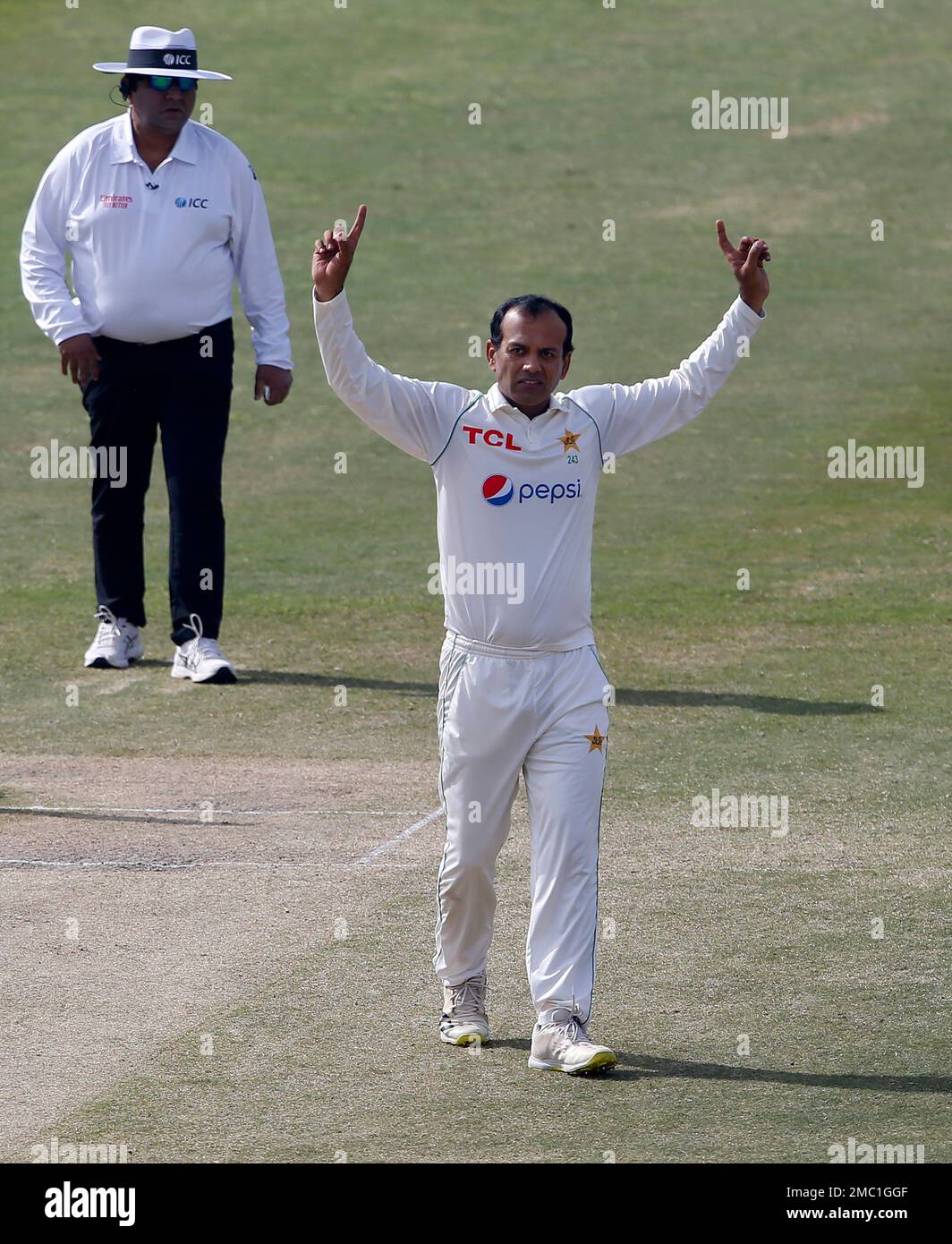 Pakistan's Nauman Ali, front, celebrates after taking the wicket of ...