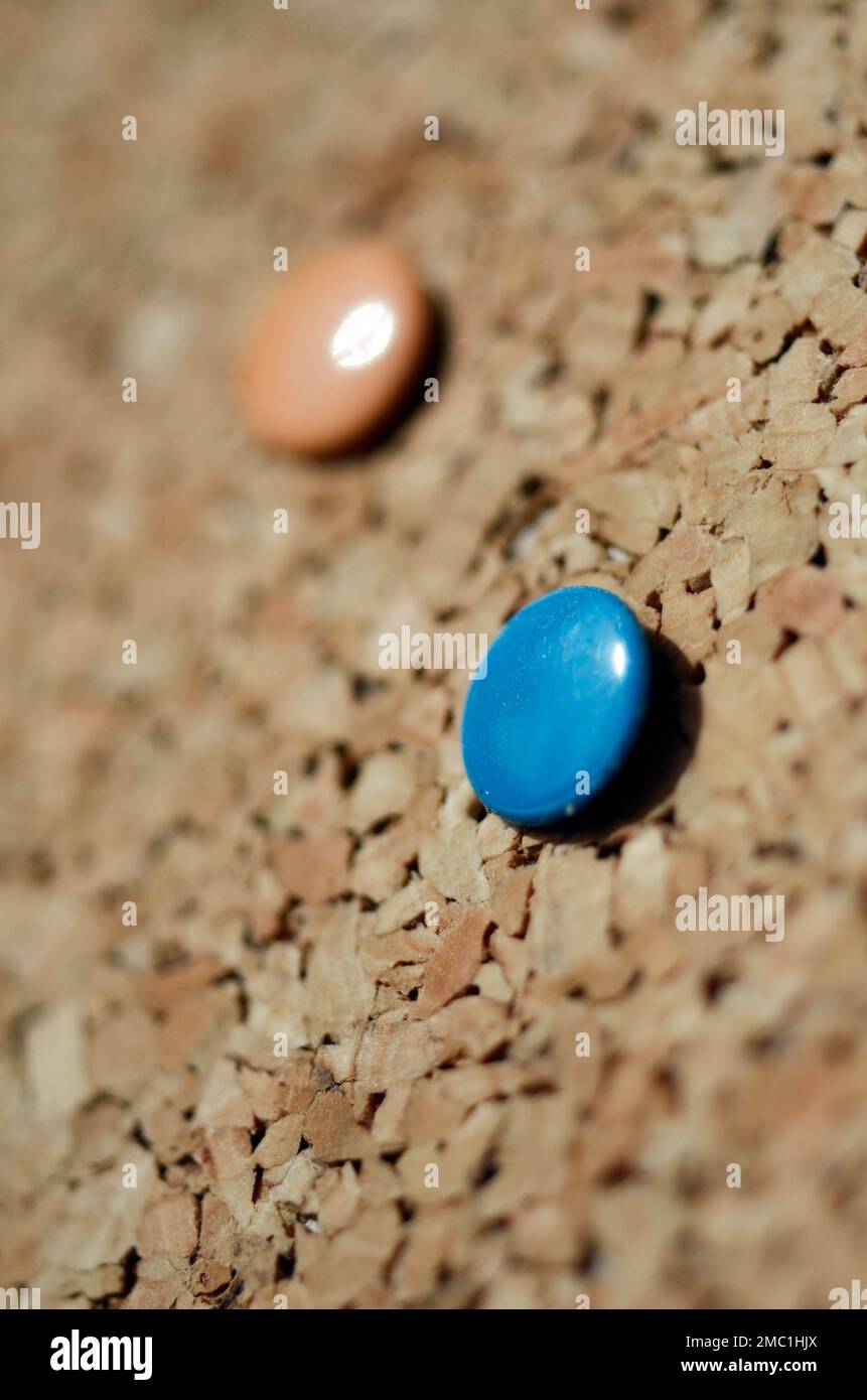 drawing pins in cork wall board Stock Photo - Alamy