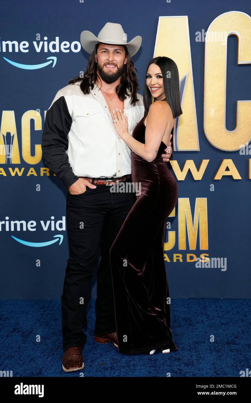 Brock Davies, left, and Scheana Shay arrive at the 57th Academy of ...