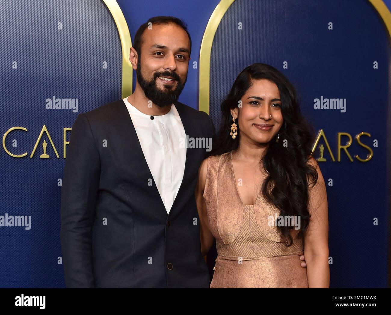 Sushmit Ghosh, left, and Rintu Thomas arrive at the 94th Academy Awards nominees luncheon on ...