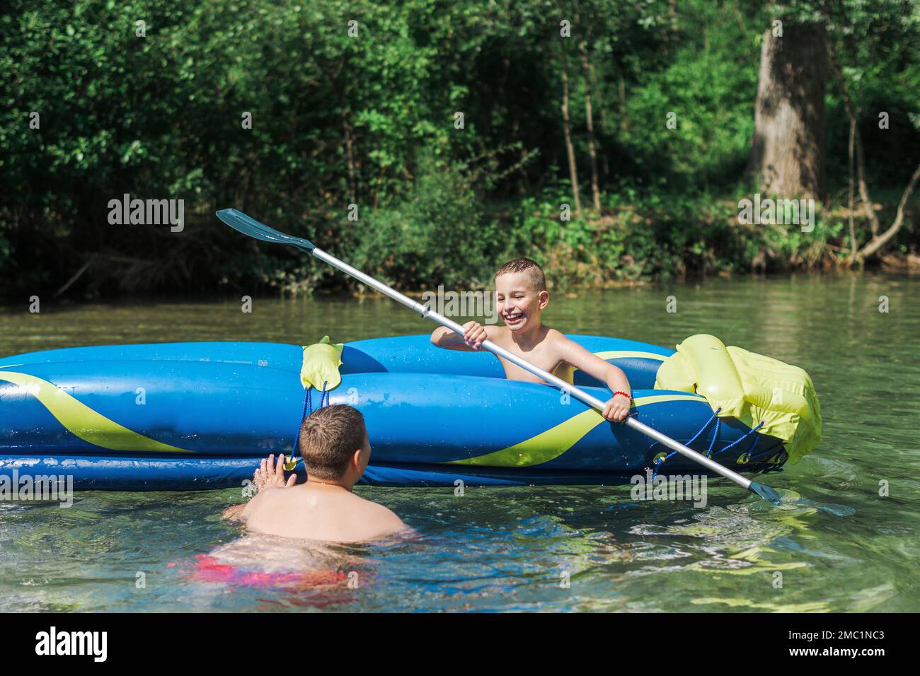 Two boys on raft river hi-res stock photography and images - Alamy