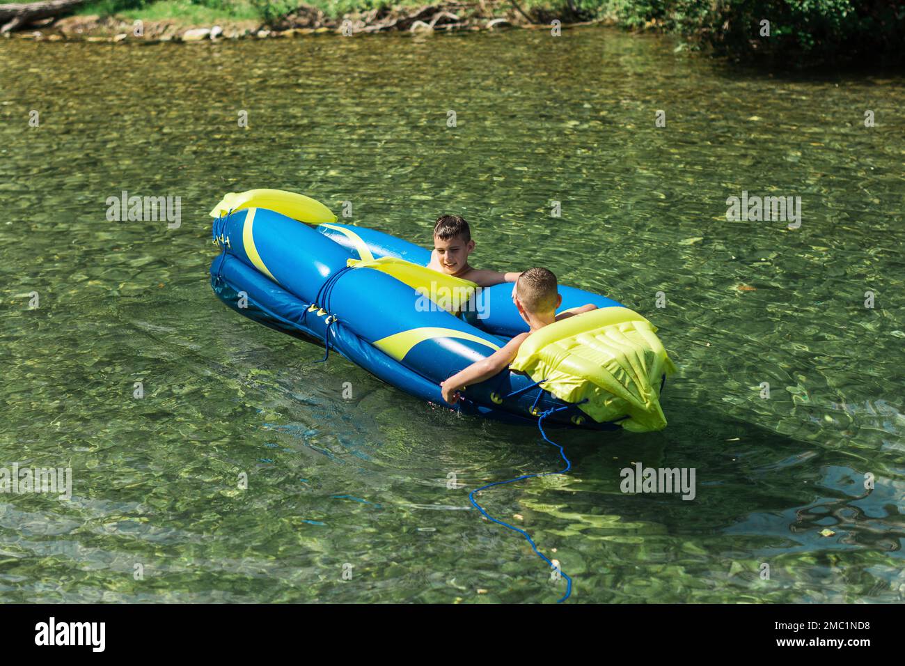 Two boys on raft river hi-res stock photography and images - Alamy