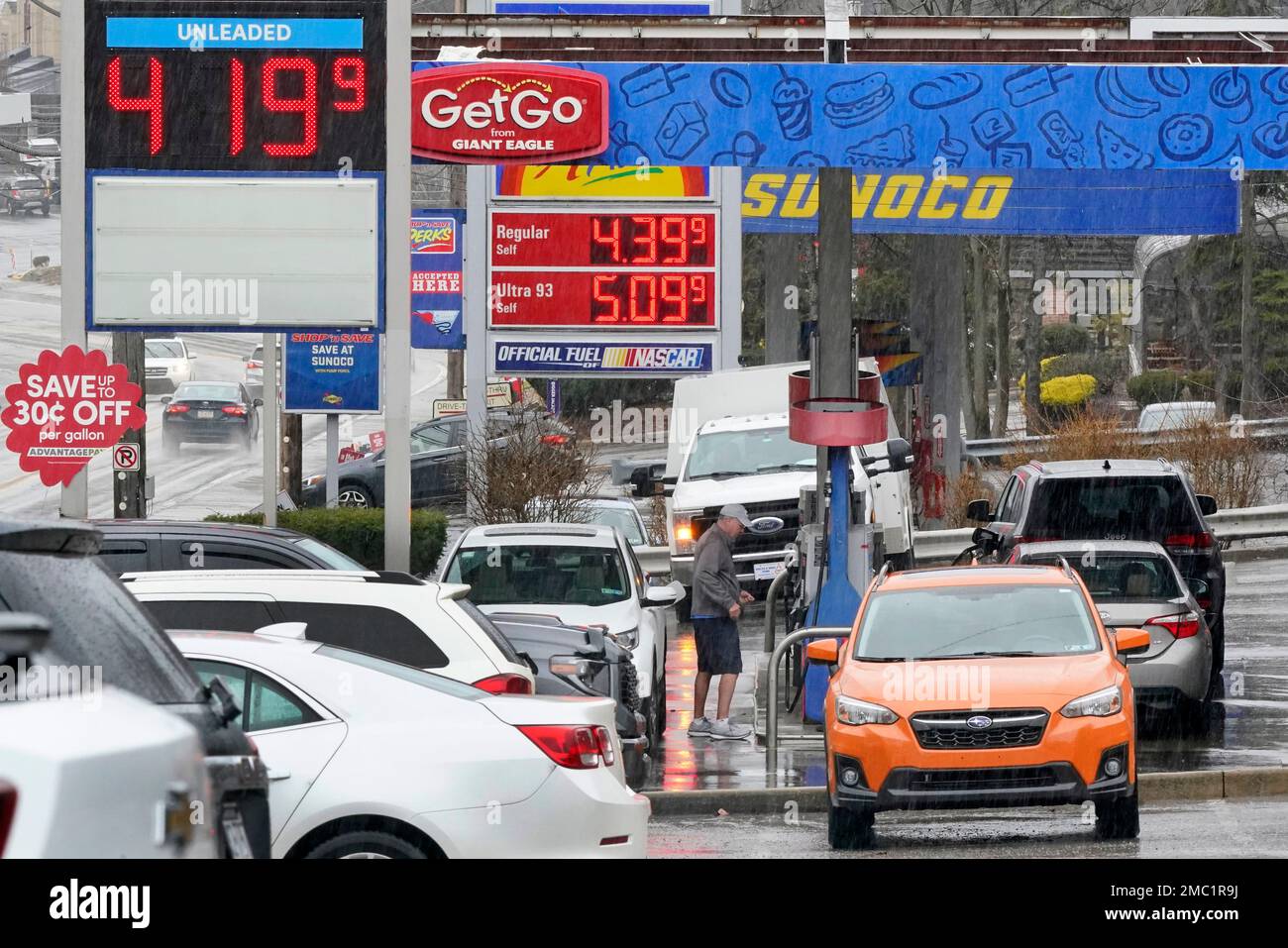 People pump gas at a Giant Eagle GetGo where a gallon of unleaded ...