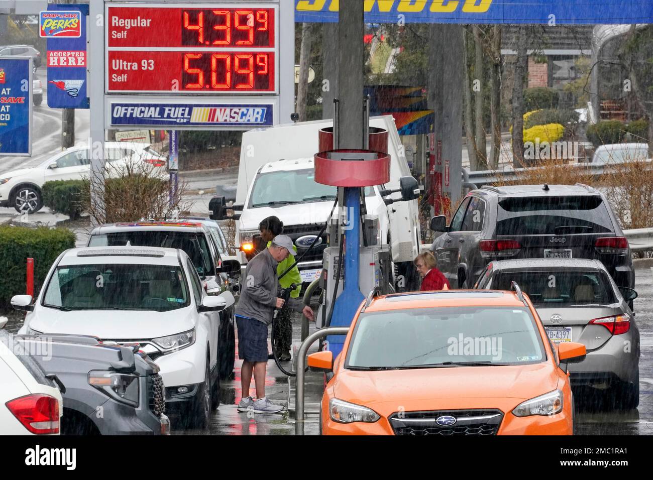 People pump gas at a Giant Eagle GetGo where a gallon of unleaded ...