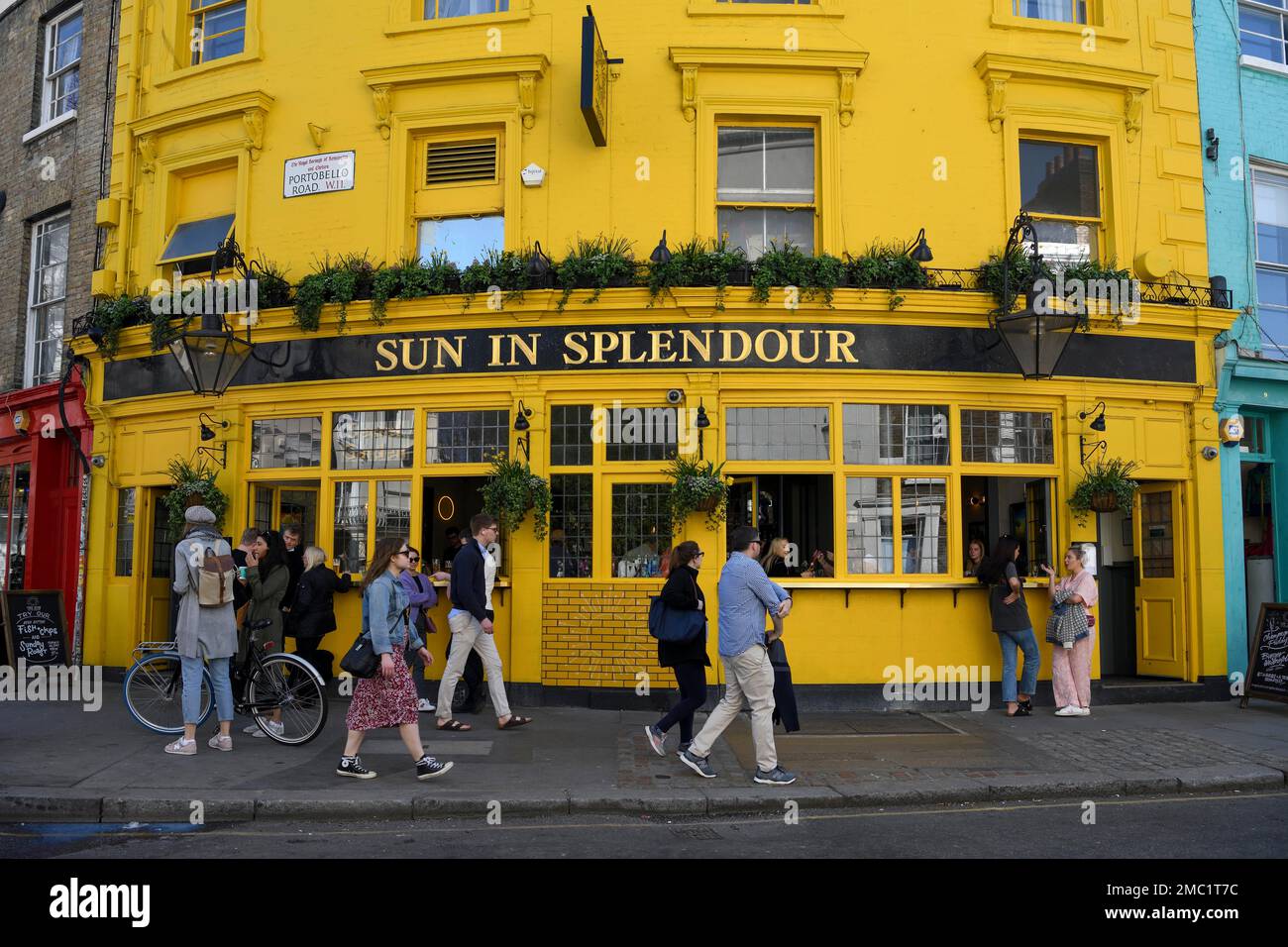 Guests and passers-by outside the Sun pub in Splendour on Portobello ...
