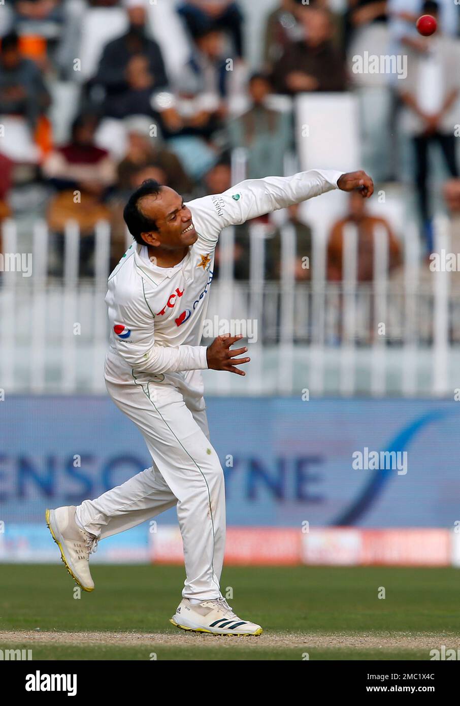 Pakistan's Nauman Ali bowls during the 4th day of the first test match ...