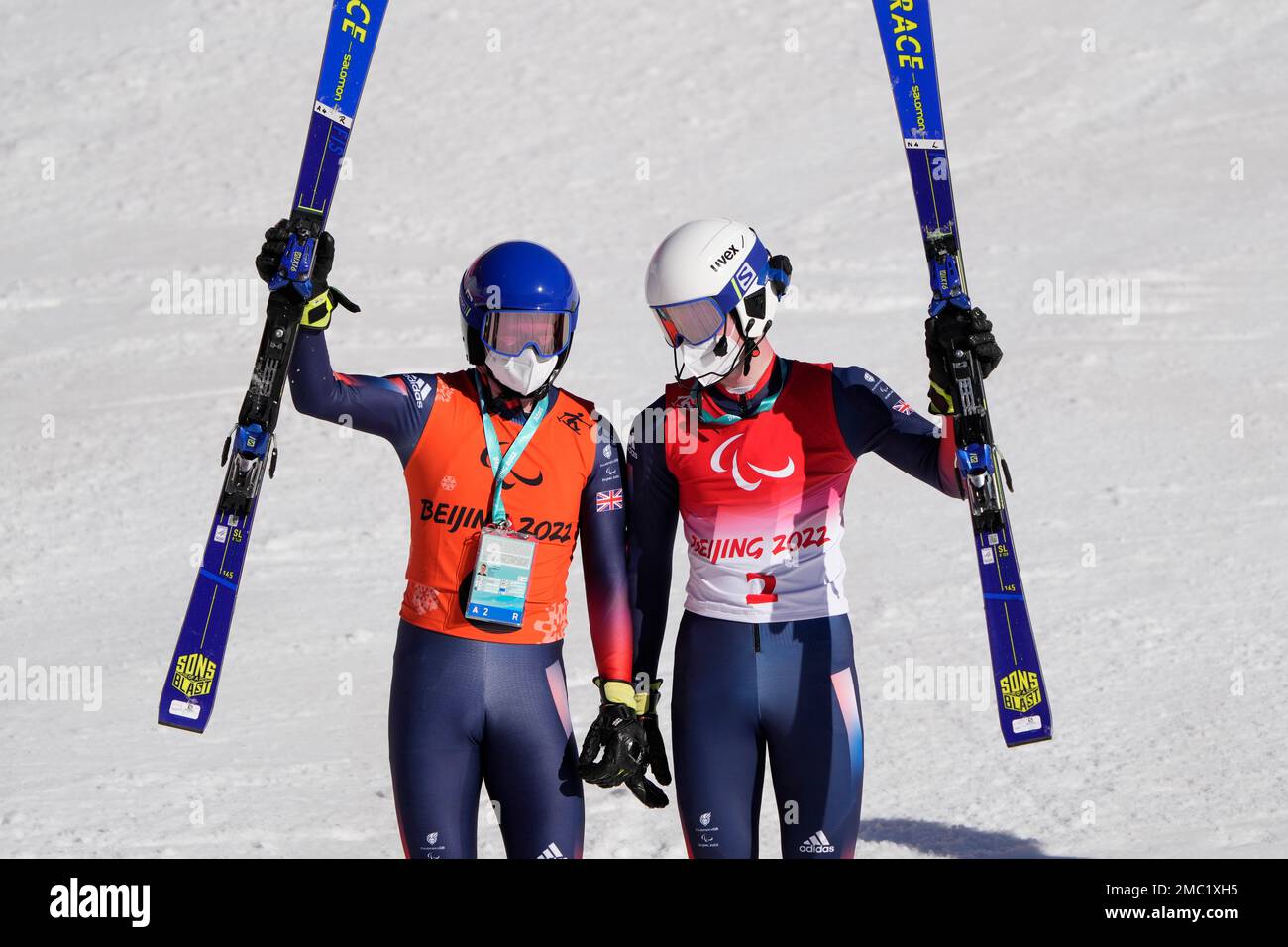 Neil Simpson of Britain and guide Andrew Simpson react after competing ...