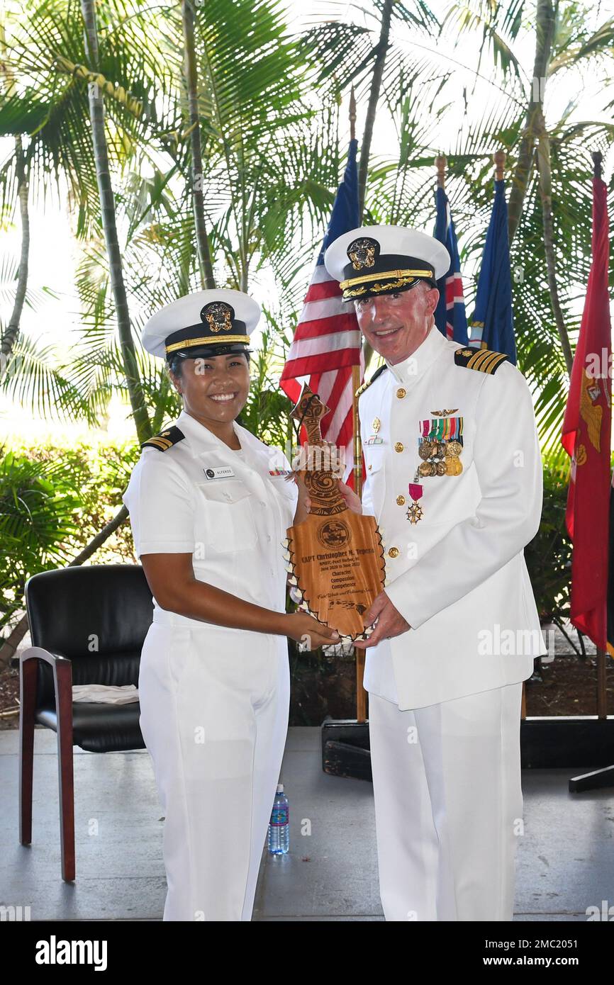 Lt. Sarah Alferos presents Capt. Christopher Tepera a departing gift ...