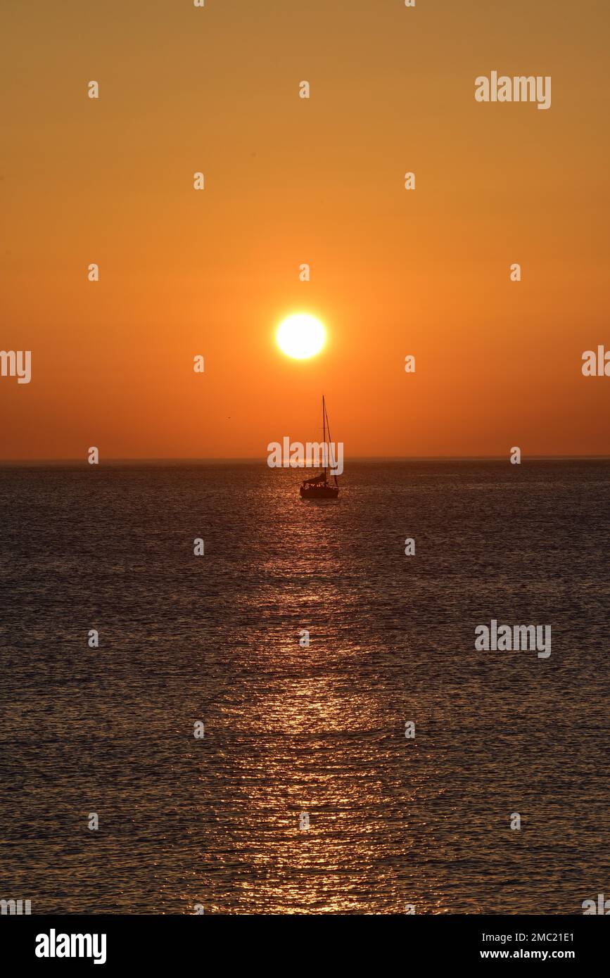 Sunset with sailboat on the Atlantic Ocean in Normandy, France Stock ...